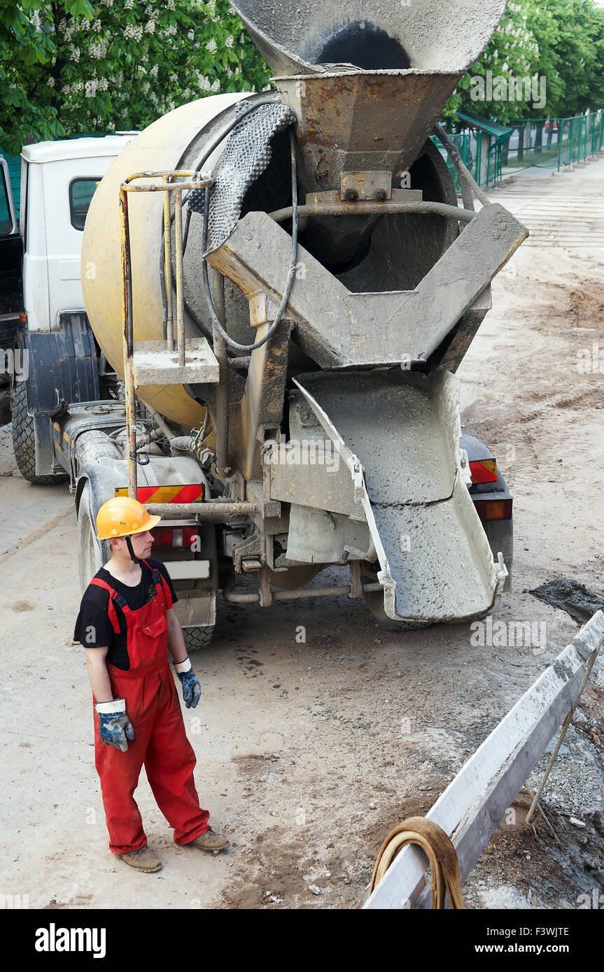 construction builder and concrete mixer Stock Photo - Alamy