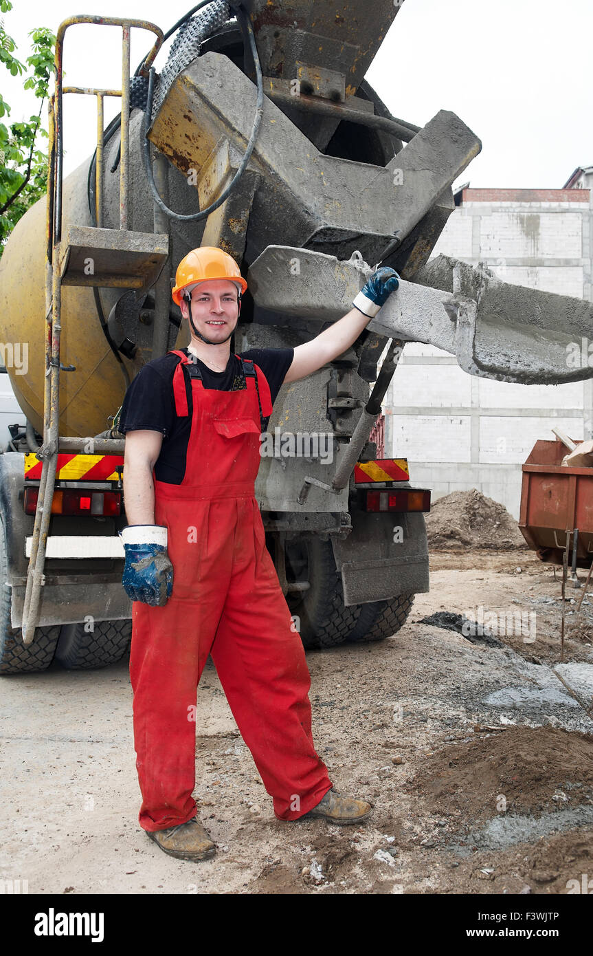construction builder and concrete mixer Stock Photo - Alamy