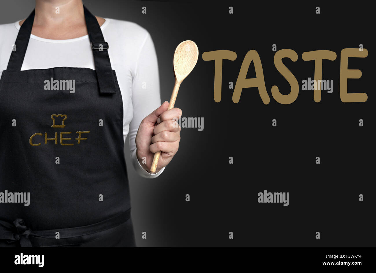 taste cook holding wooden spoon background concept Stock Photo - Alamy