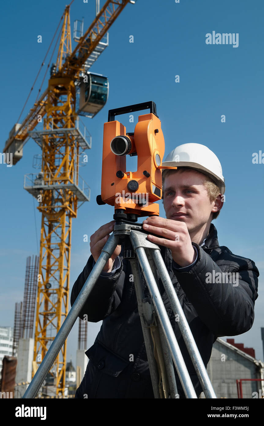 Surveyor with transit level equipment Stock Photo - Alamy