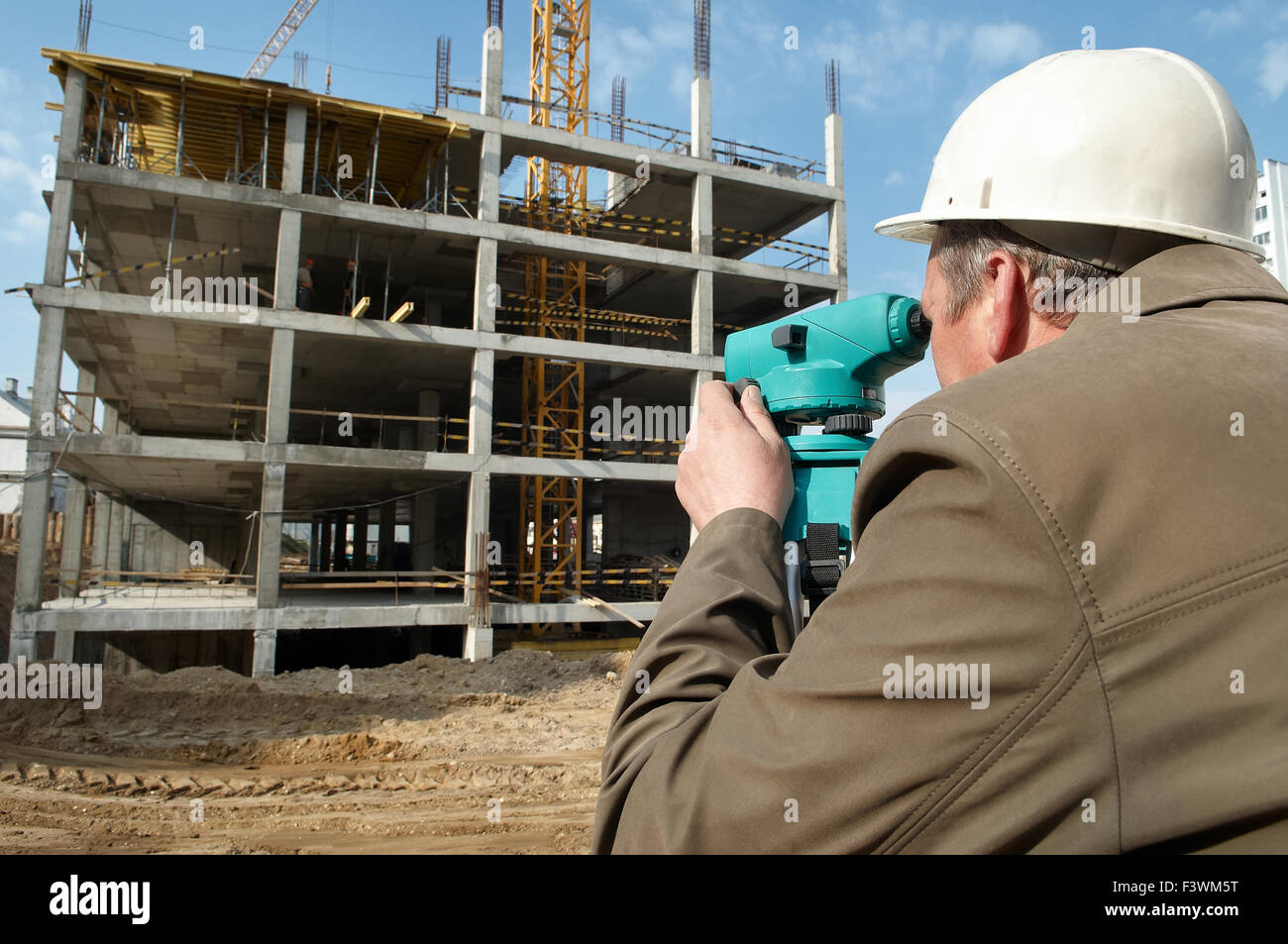 Surveyor with transit level equipment Stock Photo - Alamy