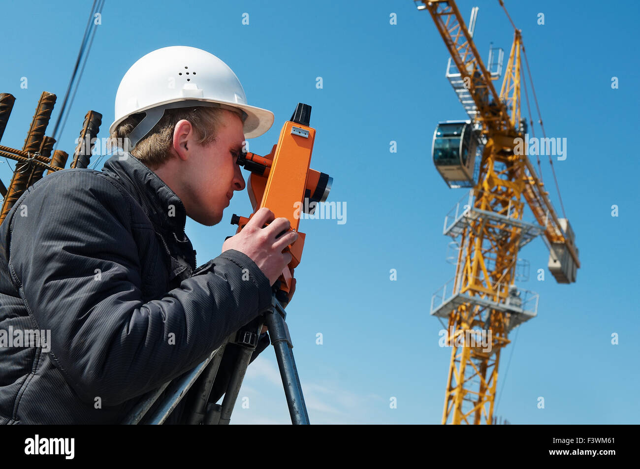 Surveyor with transit level equipment Stock Photo - Alamy