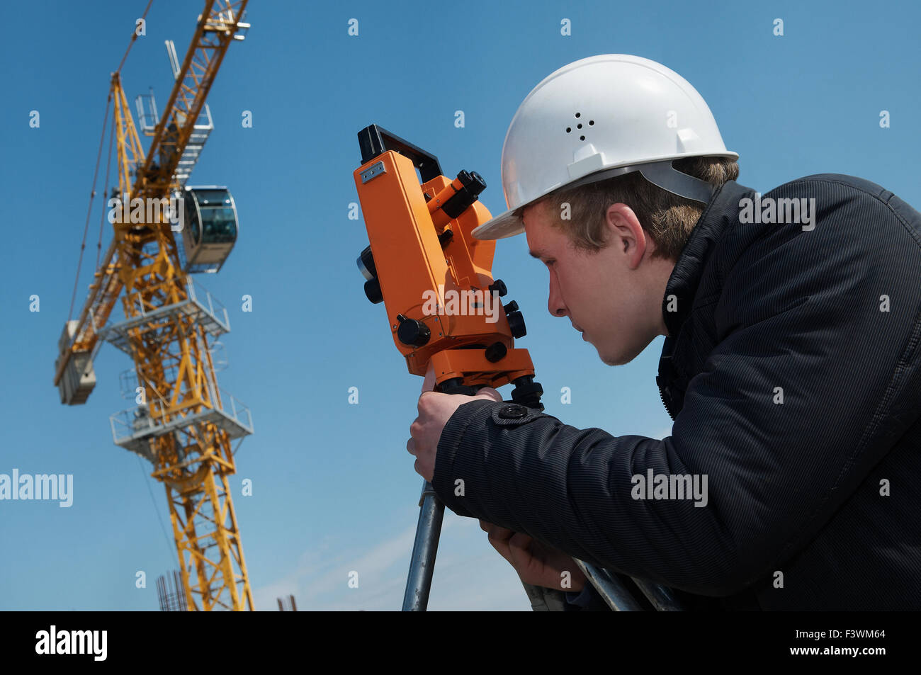 Surveyor with transit level equipment Stock Photo - Alamy