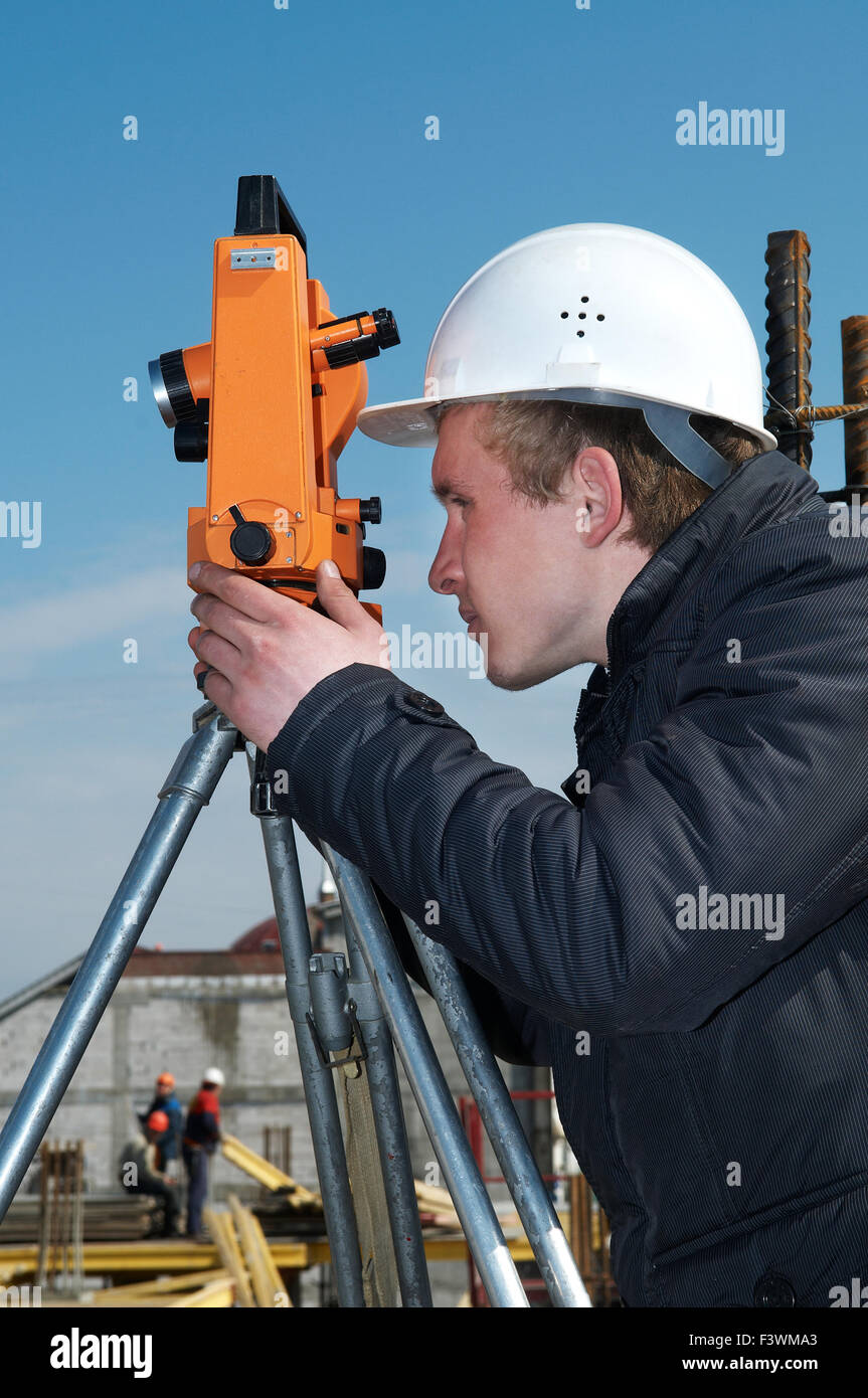 Surveyor with transit level equipment Stock Photo - Alamy