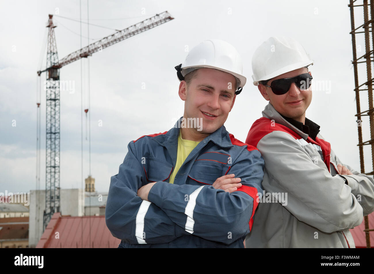 happy builders at construction site Stock Photo - Alamy
