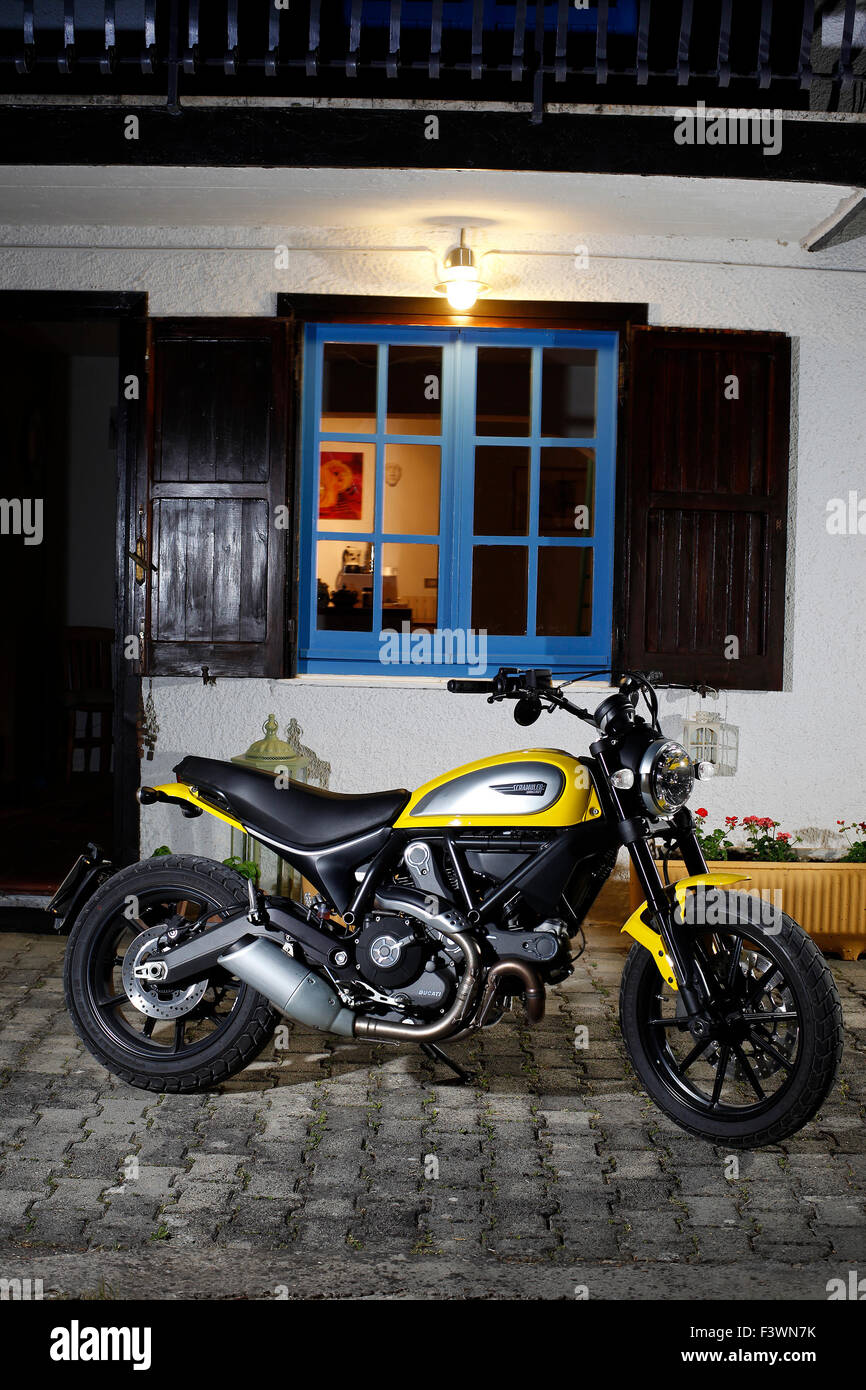 Ducati Scrambler outside house at night Stock Photo - Alamy