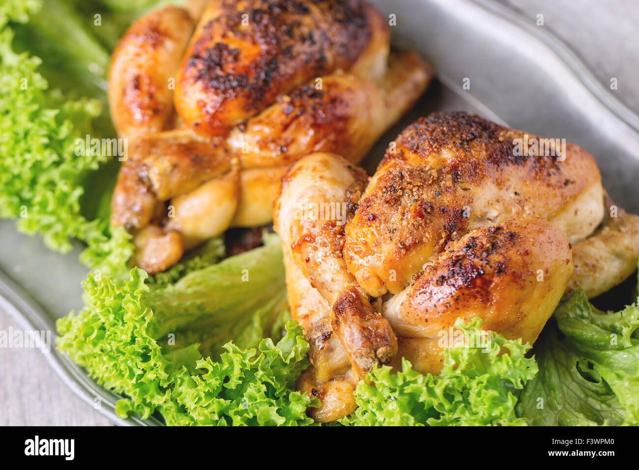Whole Grilled mini chicken Stock Photo - Alamy