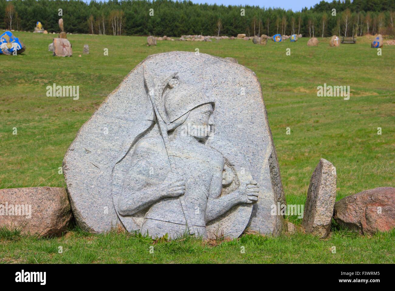 erratic block in park Stock Photo - Alamy