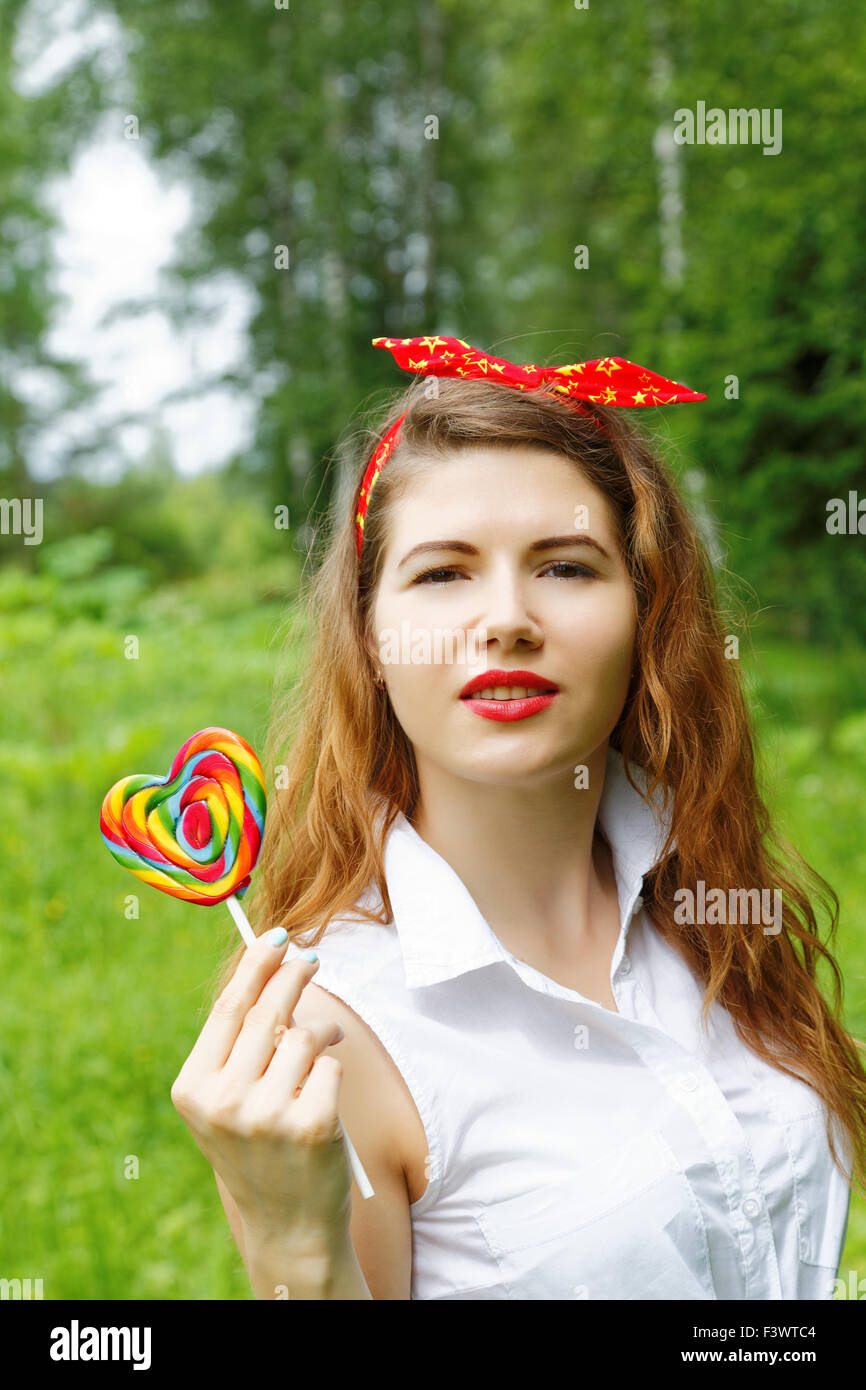 Girl lollipop in trees hi-res stock photography and images - Alamy