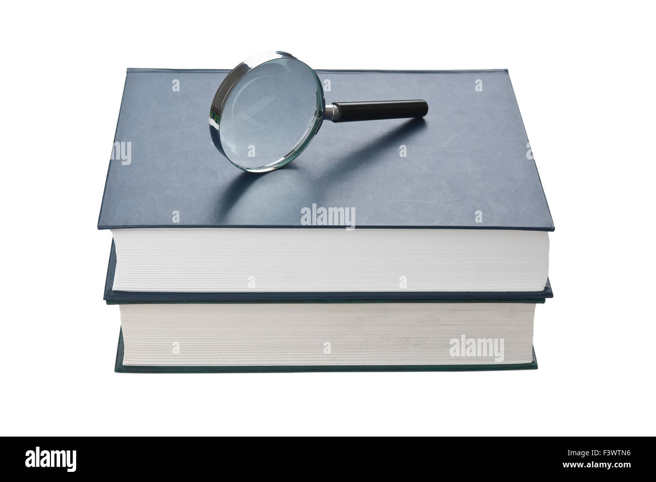 books and magnifying glass Stock Photo - Alamy