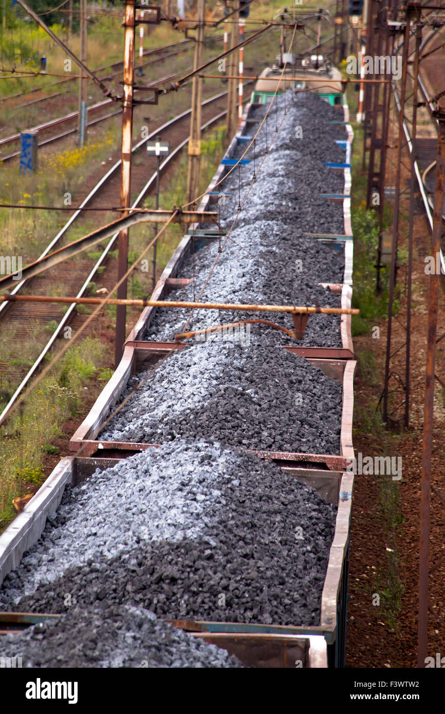 Coal train passing through the station Stock Photo - Alamy
