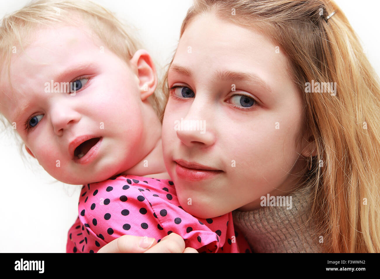 Teenager with a baby Stock Photo - Alamy