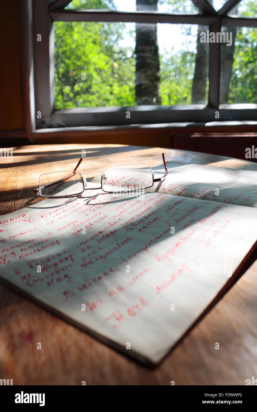 Entries in a paper notebook Stock Photo - Alamy