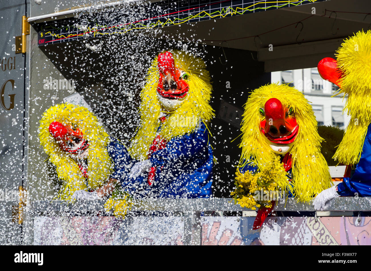 Masked men and women are joining the great procession of Basler Fasnet ...