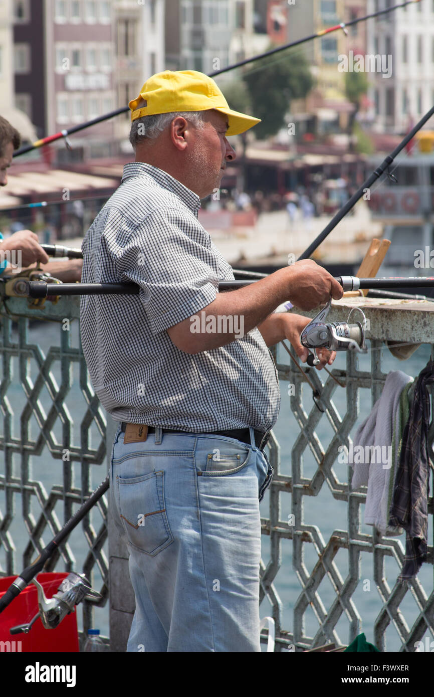 Fisherman on Galata Bridge in Istanbul Turkey Stock Photo - Alamy