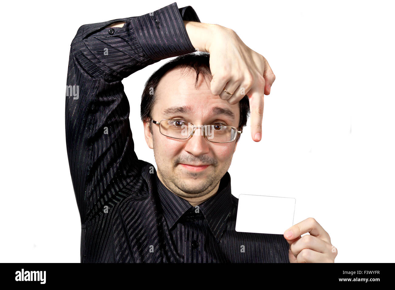 Solid men points to the businesscard Stock Photo - Alamy