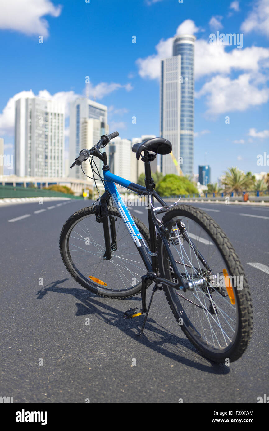 Bicycle On Empty Road Stock Photo - Alamy