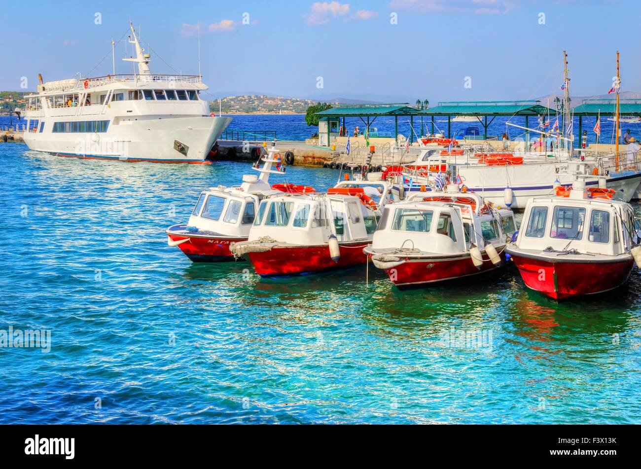 A view of the port of the beautiful Greek Island, Spetses. Four boats ...