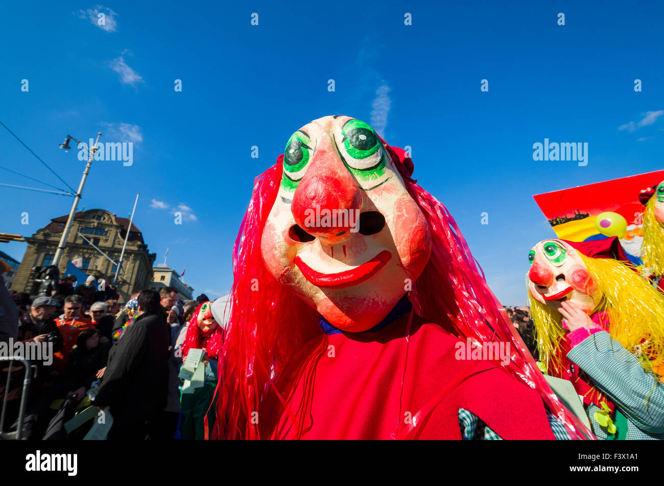 Masked men and women are joining the great procession of Basler Fasnet ...