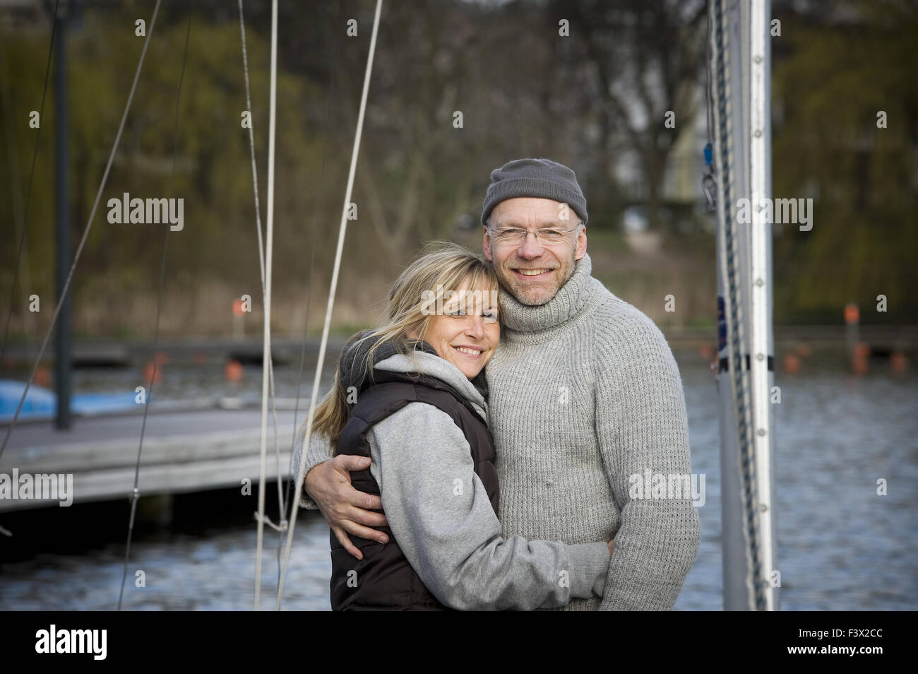 Happy couple hug each other Stock Photo - Alamy
