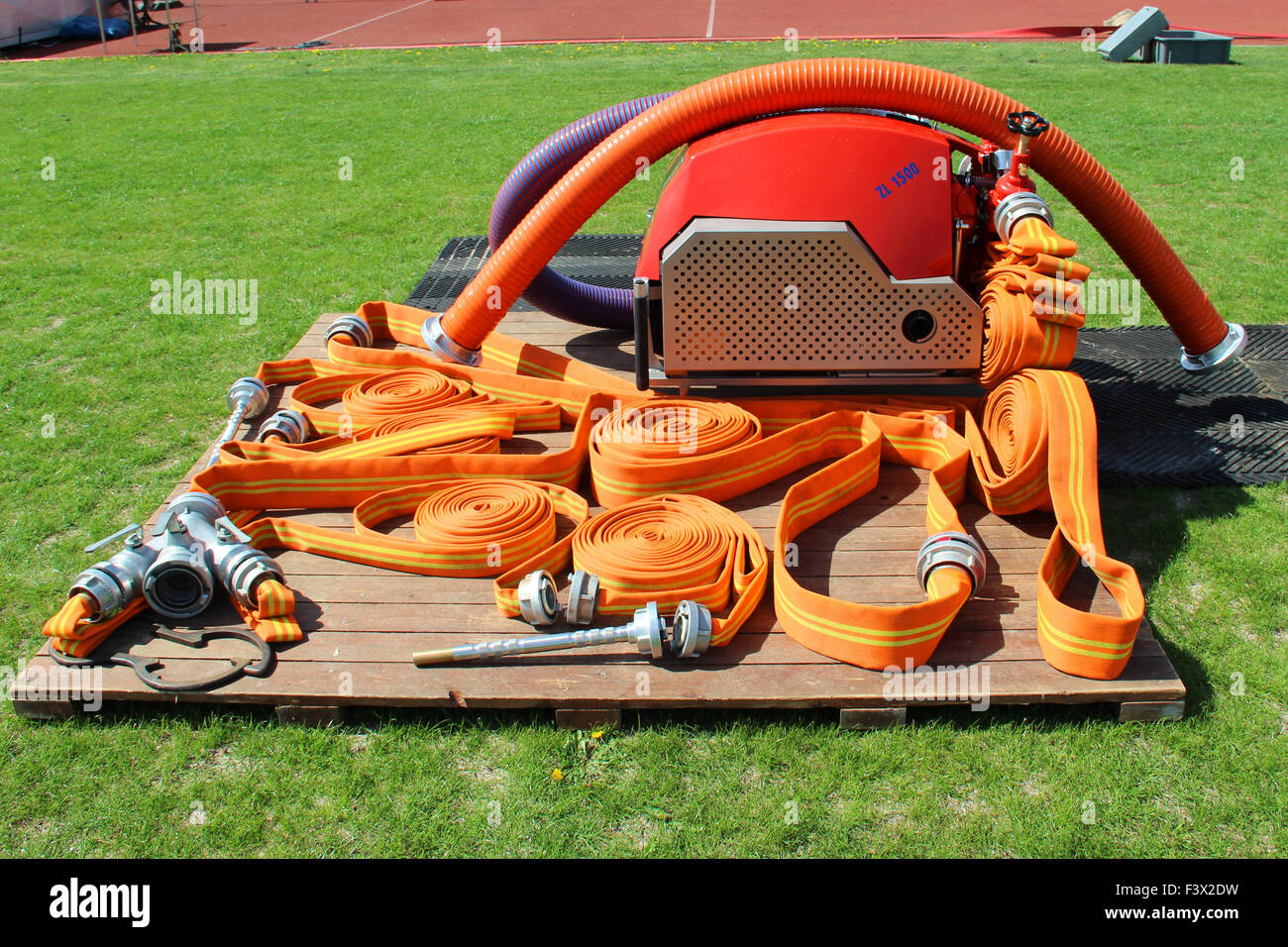 fire brigade, hoses and pump Stock Photo - Alamy