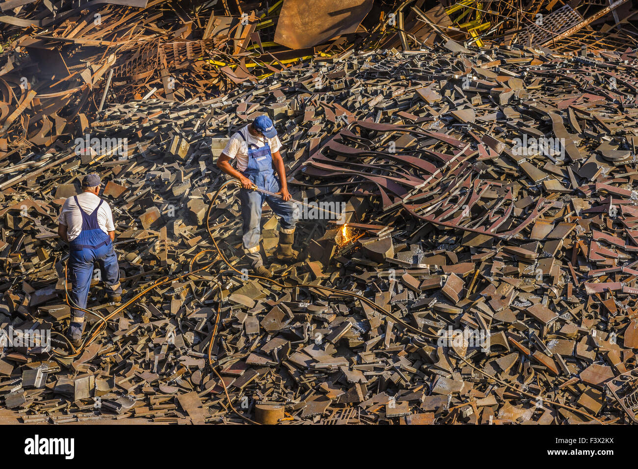 workers cutting scrap metal Stock Photo - Alamy