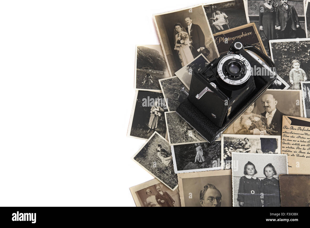 Nostalgic Photographs and roll film camera Stock Photo - Alamy