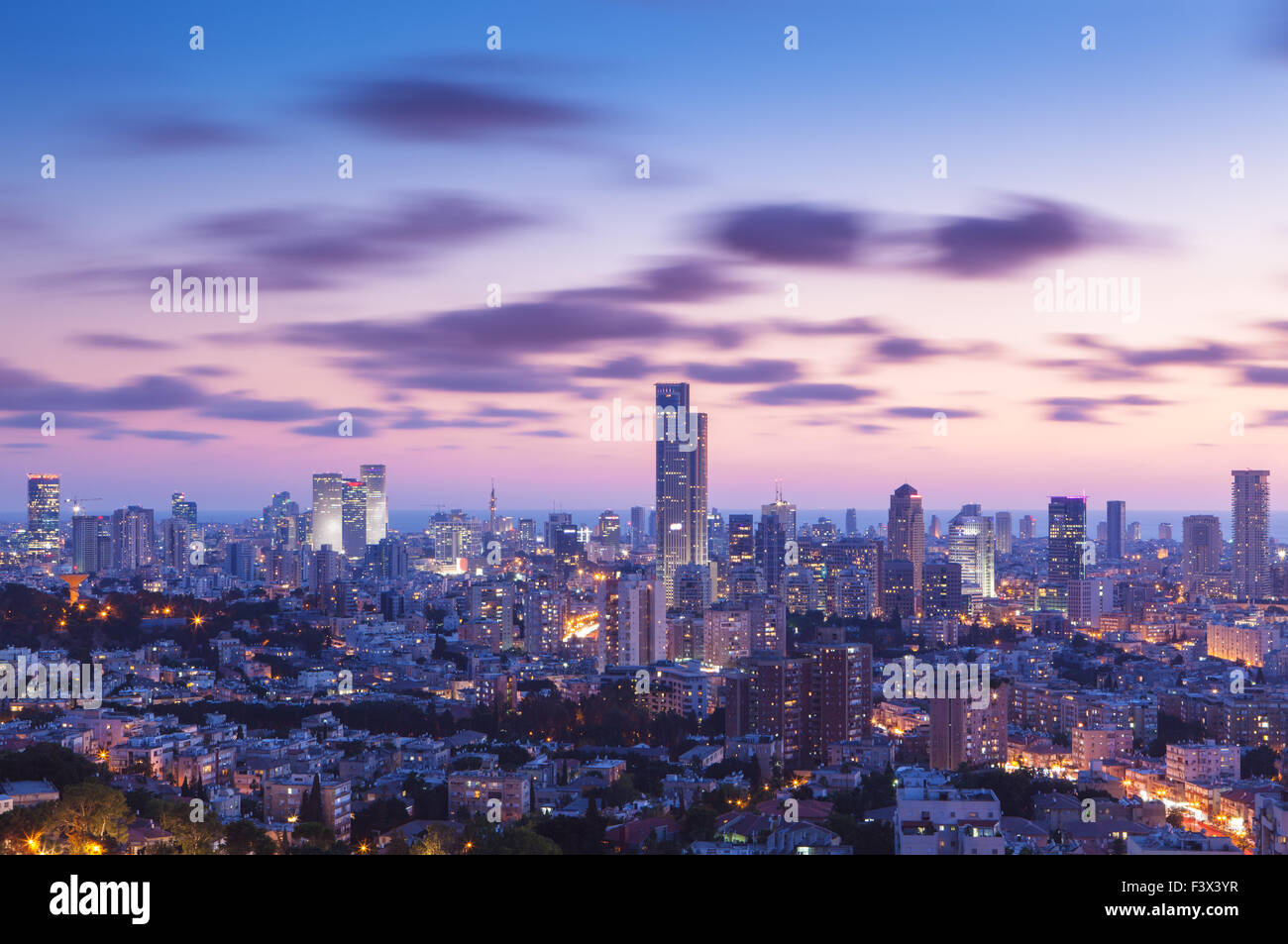 Cityscape at sunset Stock Photo - Alamy