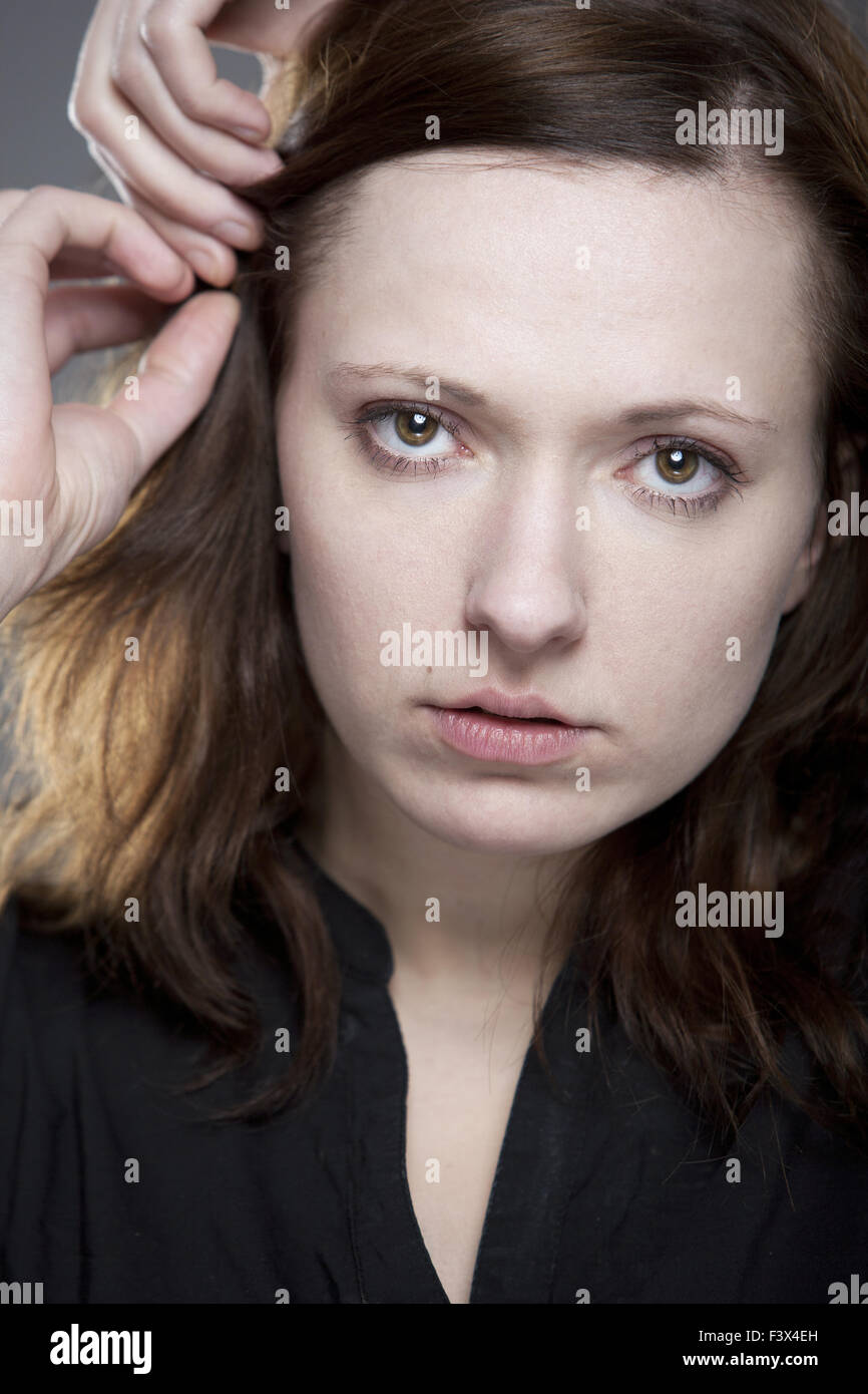 Young woman with intense look Stock Photo - Alamy