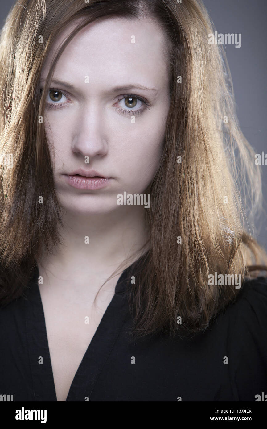 Young woman with intense look Stock Photo - Alamy