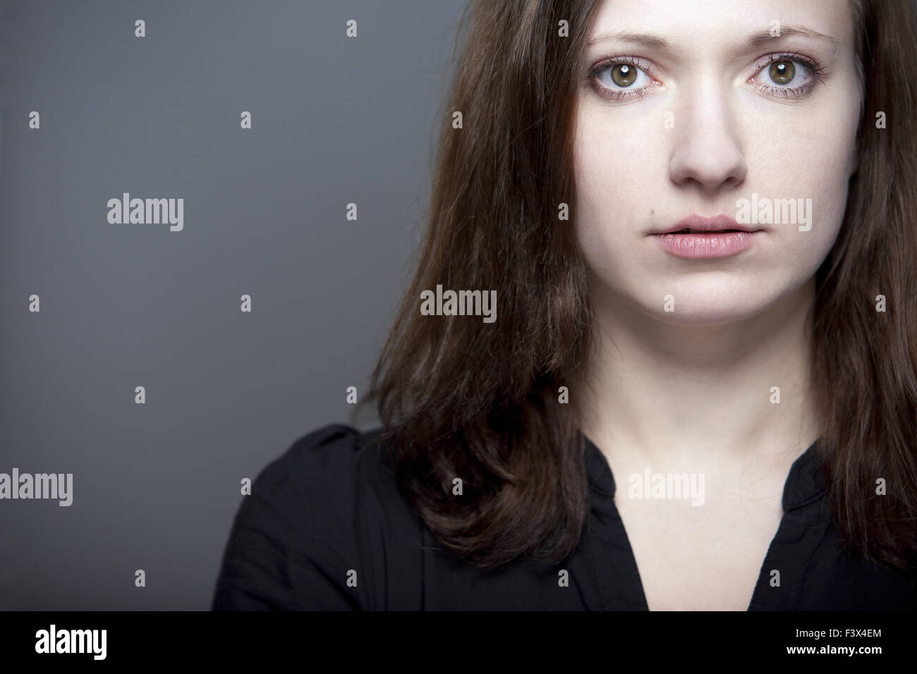 Young woman with intense look Stock Photo - Alamy