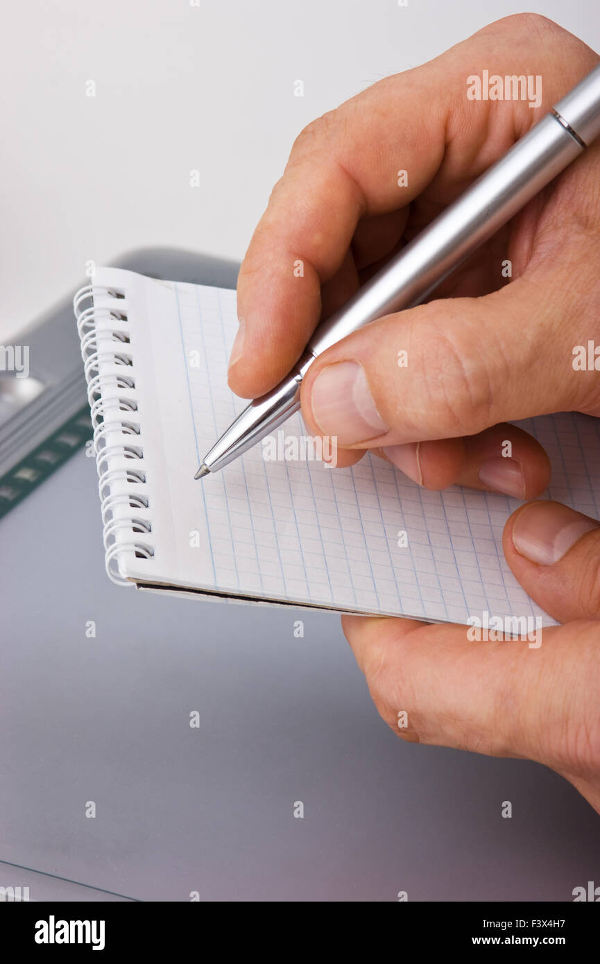 notebook in hand Stock Photo - Alamy