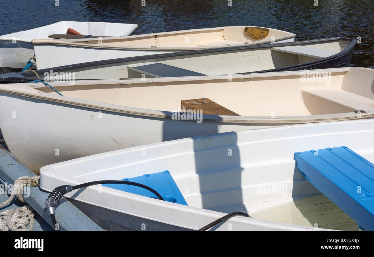 A group of small dinghies tied to a town dock Stock Photo - Alamy