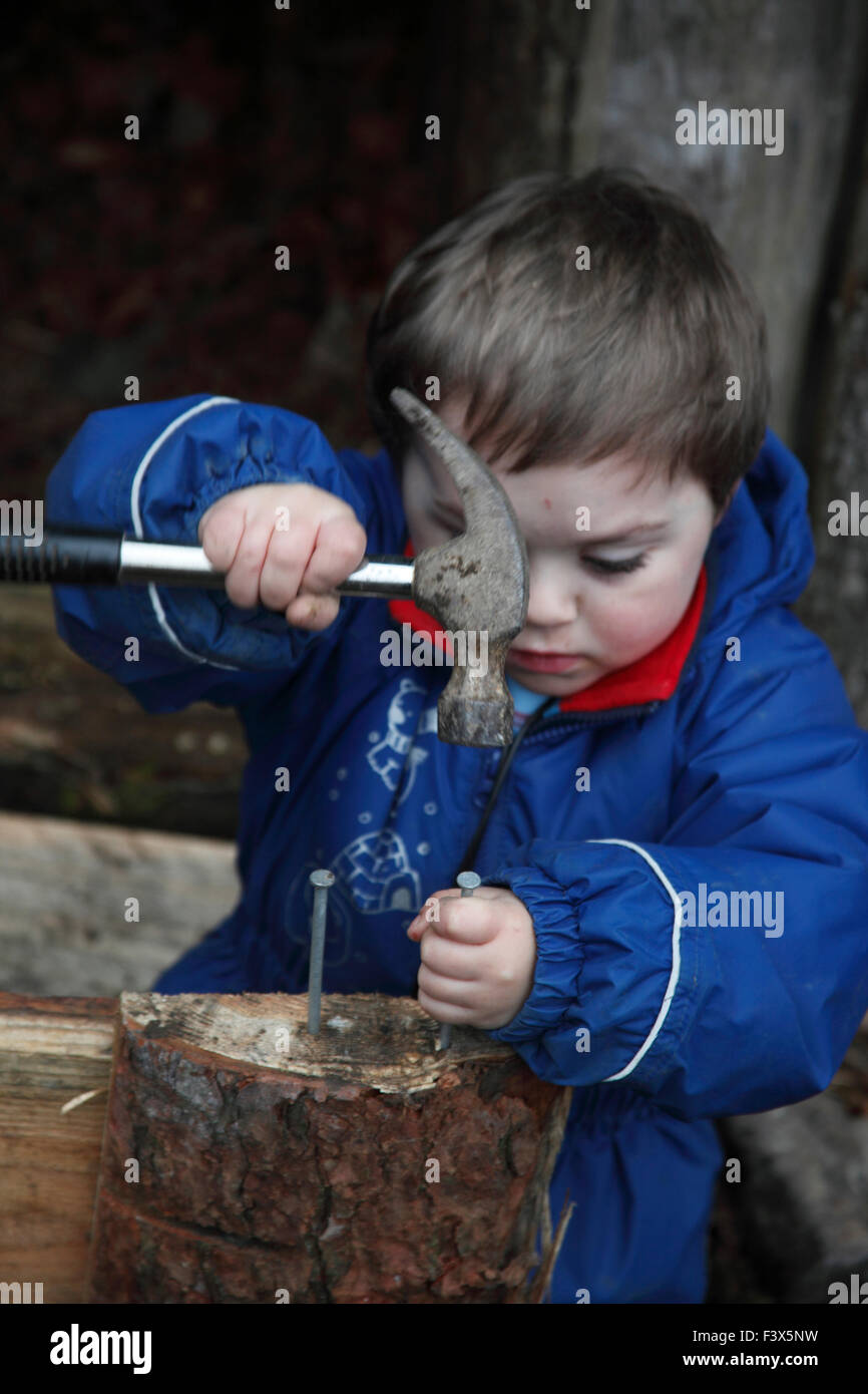 Boy with hammer hi-res stock photography and images - Alamy