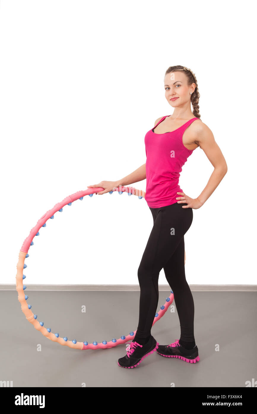 Athletic young woman with hula hoop Stock Photo - Alamy
