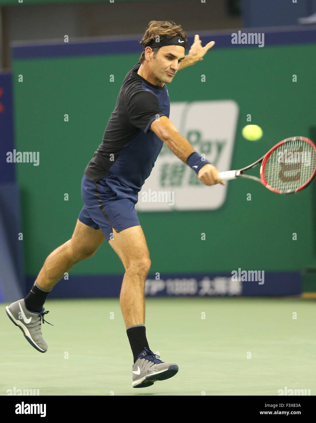 Shanghai, China. 13th Oct, 2015. Roger Federer of Switzerland hits a ...
