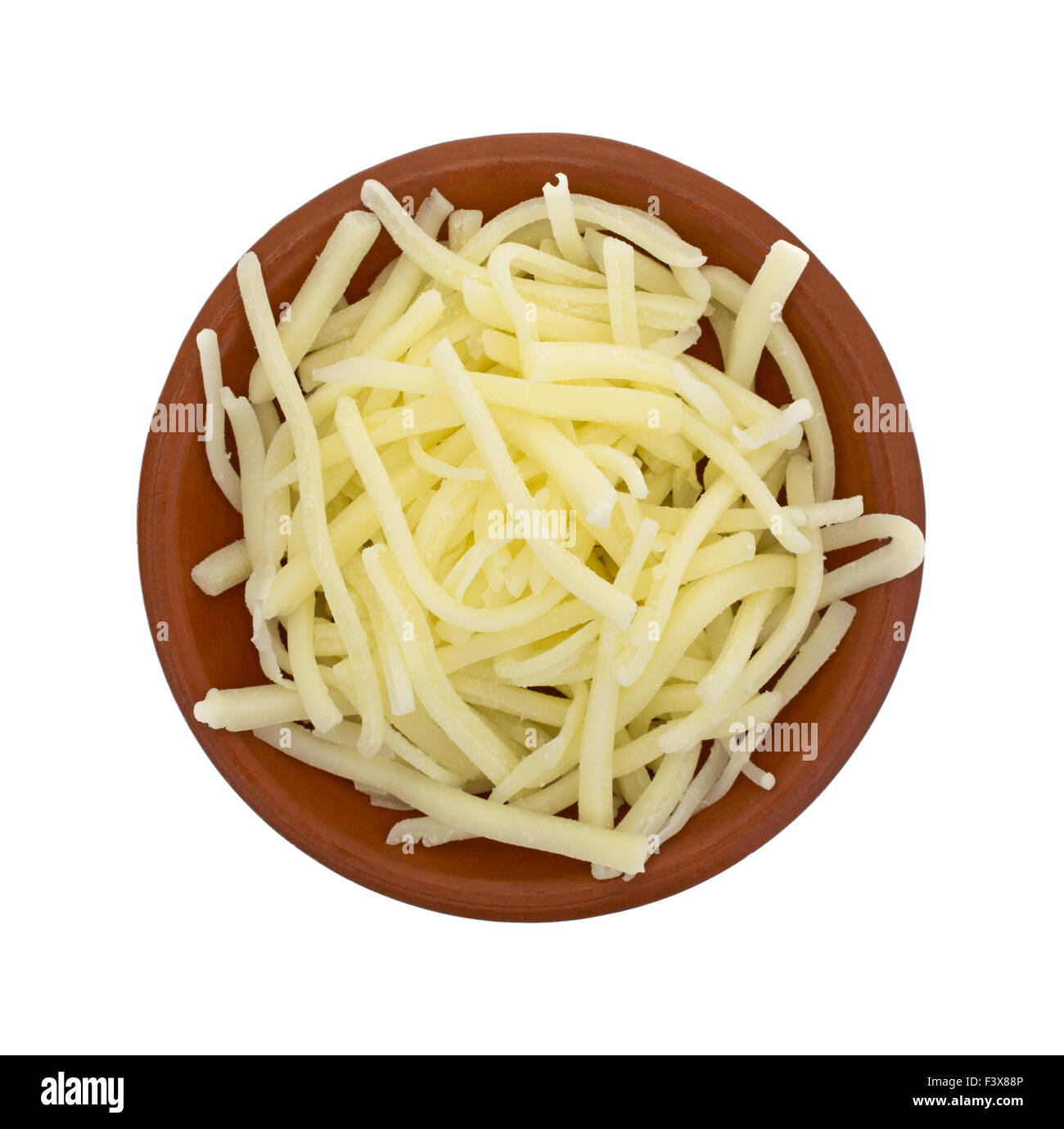 Top view of a portion of natural mild cheddar cheese in a small bowl ...