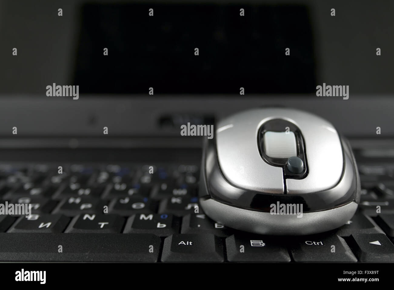 Mouse on a laptop keyboard Stock Photo - Alamy