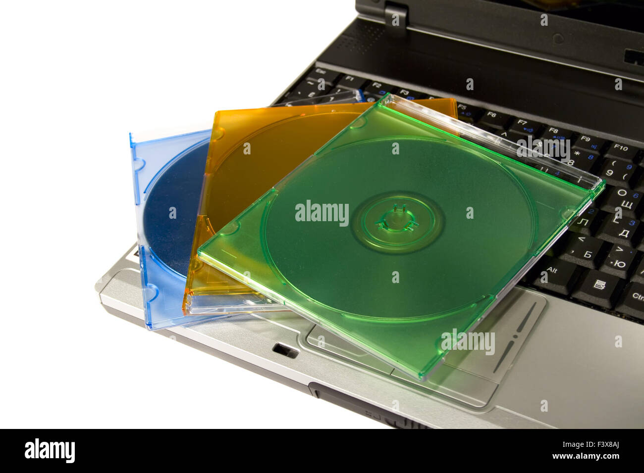 Colored cd`s on a laptop Stock Photo - Alamy