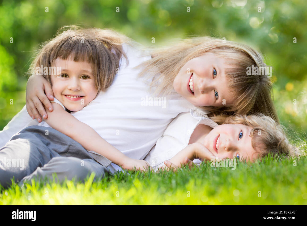 Kids in spring park Stock Photo - Alamy