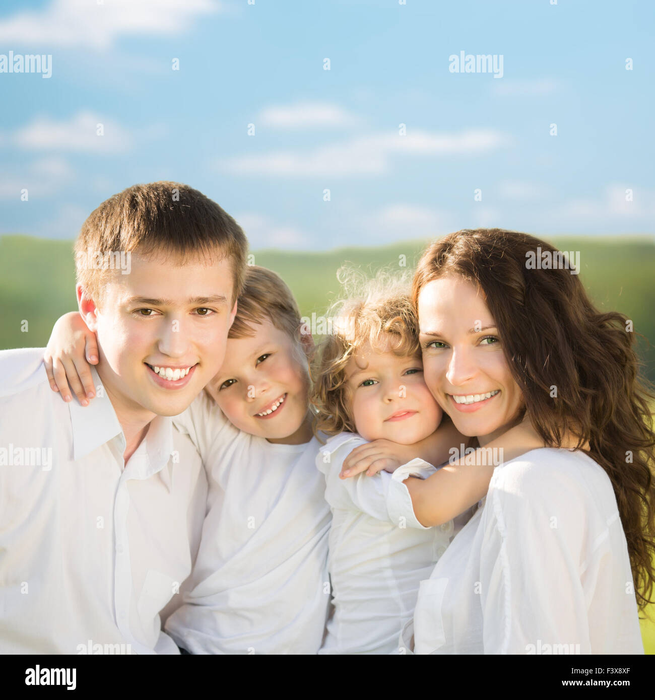 Happy family outdoors Stock Photo - Alamy