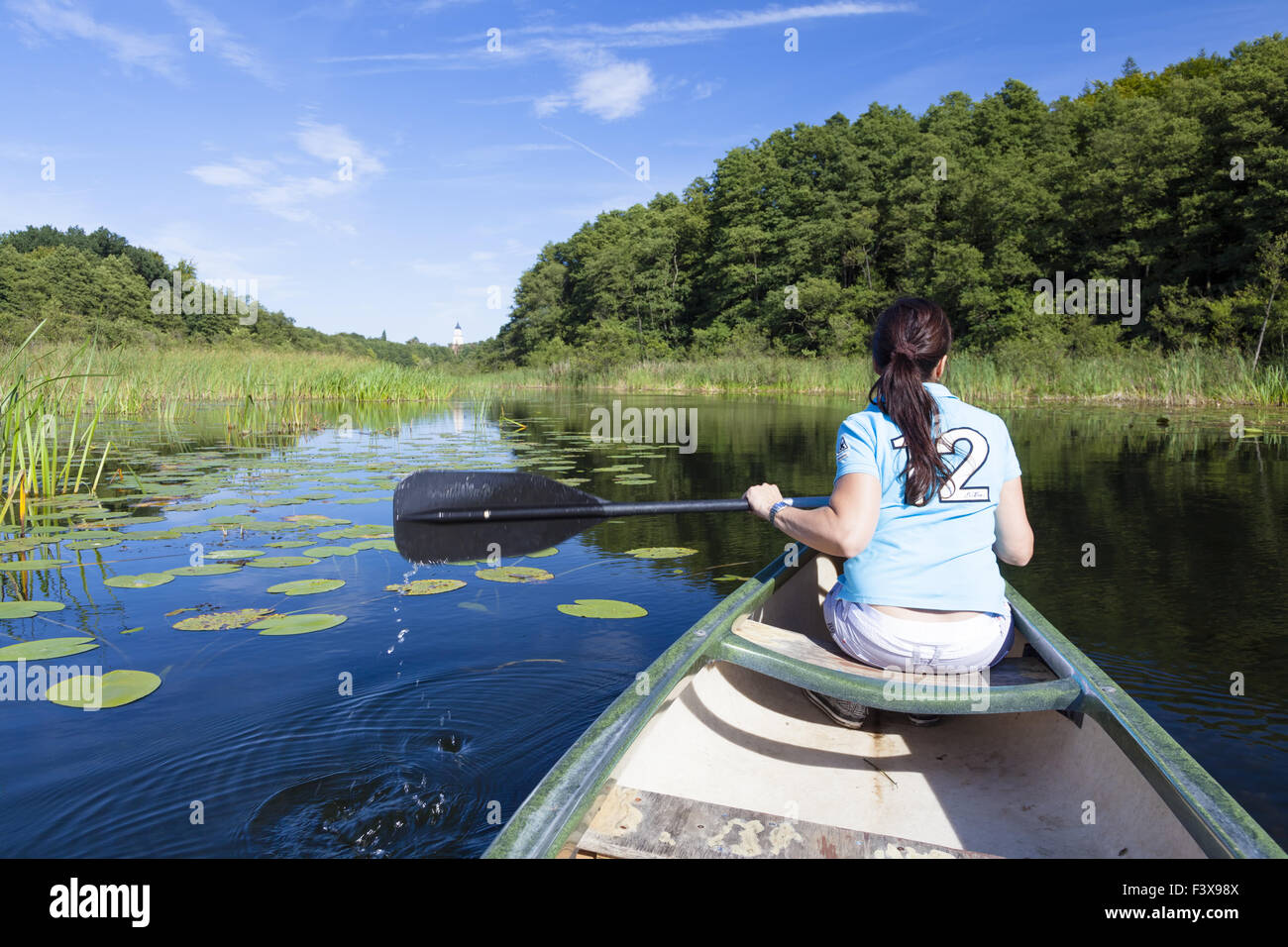 Woman paddling boat hi-res stock photography and images - Alamy