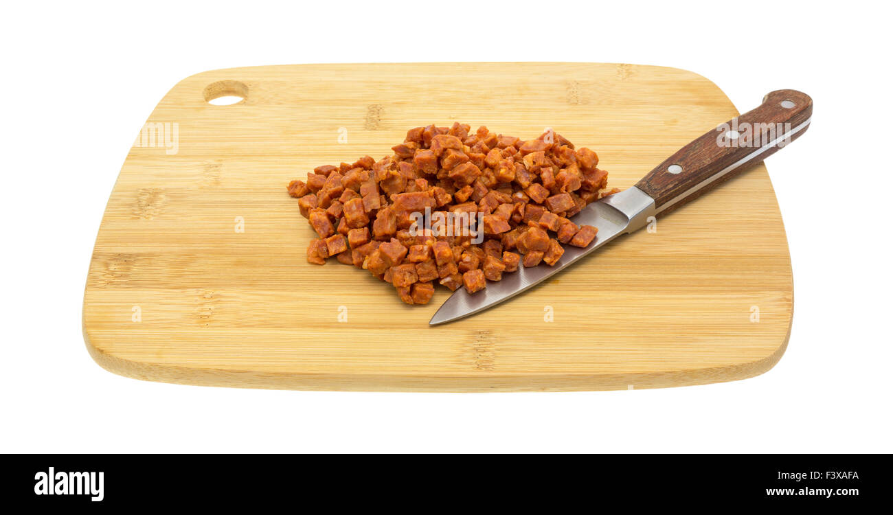 Pepperoni pizza topping that has been chopped into small cubes on a ...