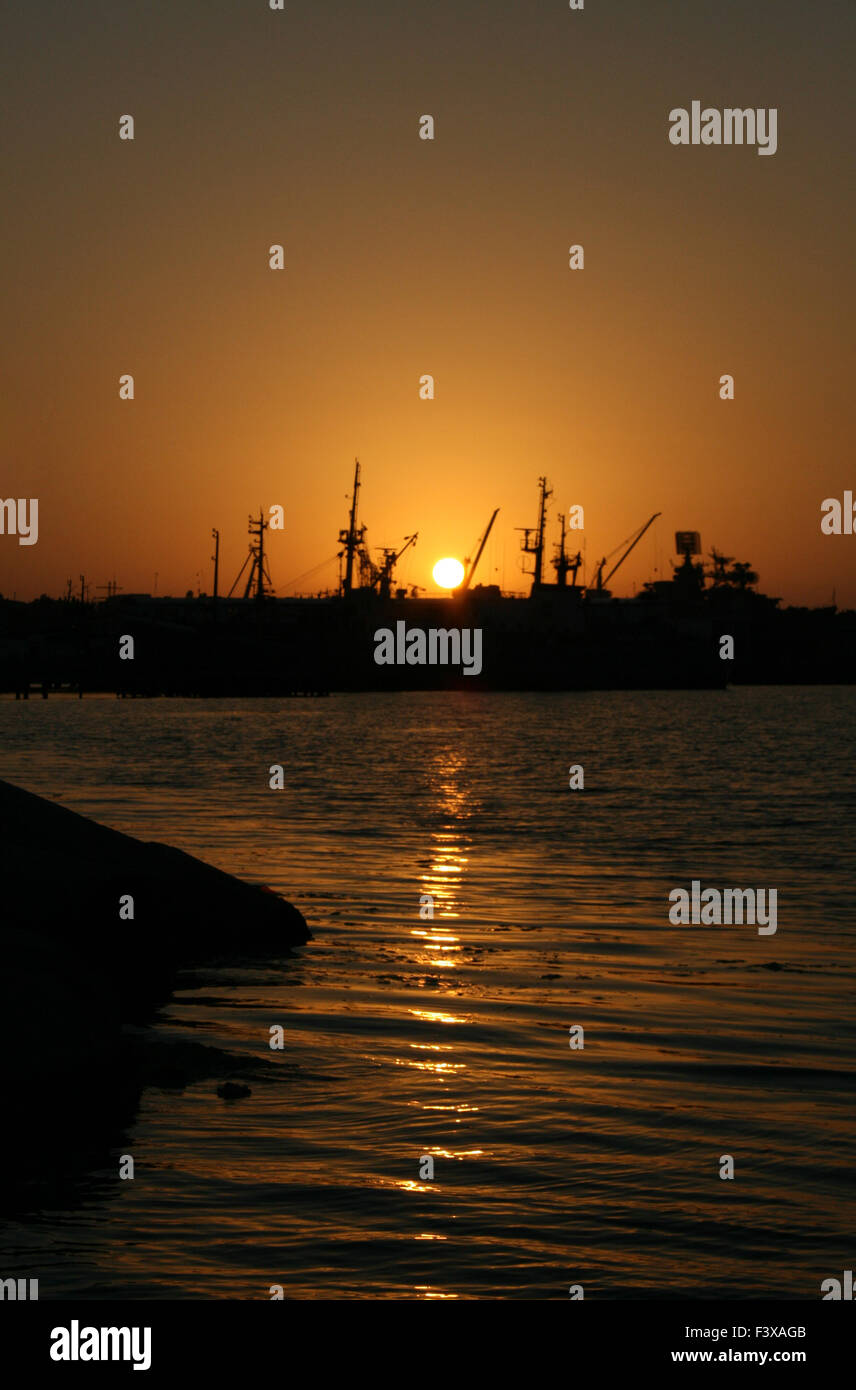 Several ships at sunset Stock Photo - Alamy