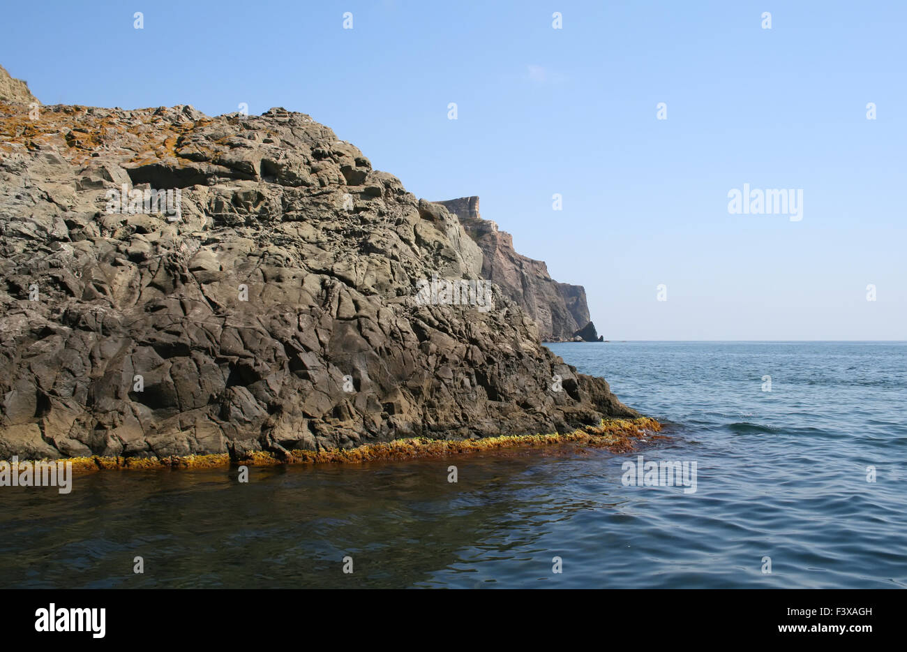Mountain on a rocky coastline.View from sea Stock Photo - Alamy