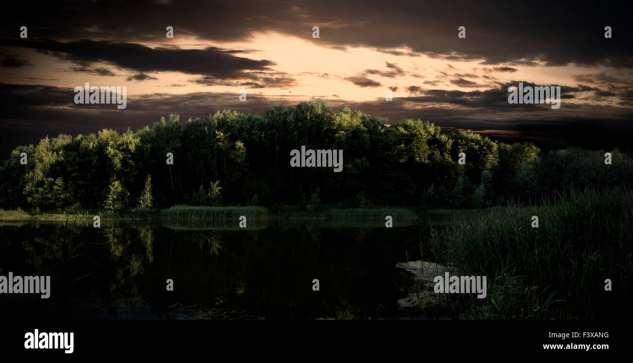 Cool dramatic sunset lake Stock Photo - Alamy