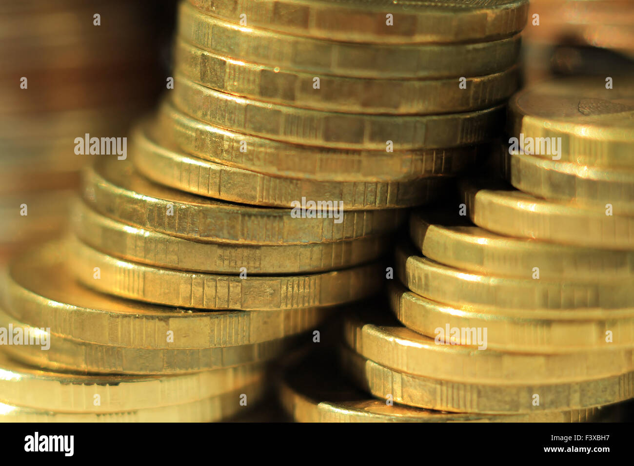 Gold coins in stacks and bulk Stock Photo - Alamy