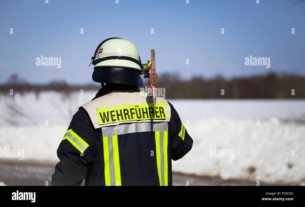 Firefighter fireman Leader with ax Stock Photo - Alamy