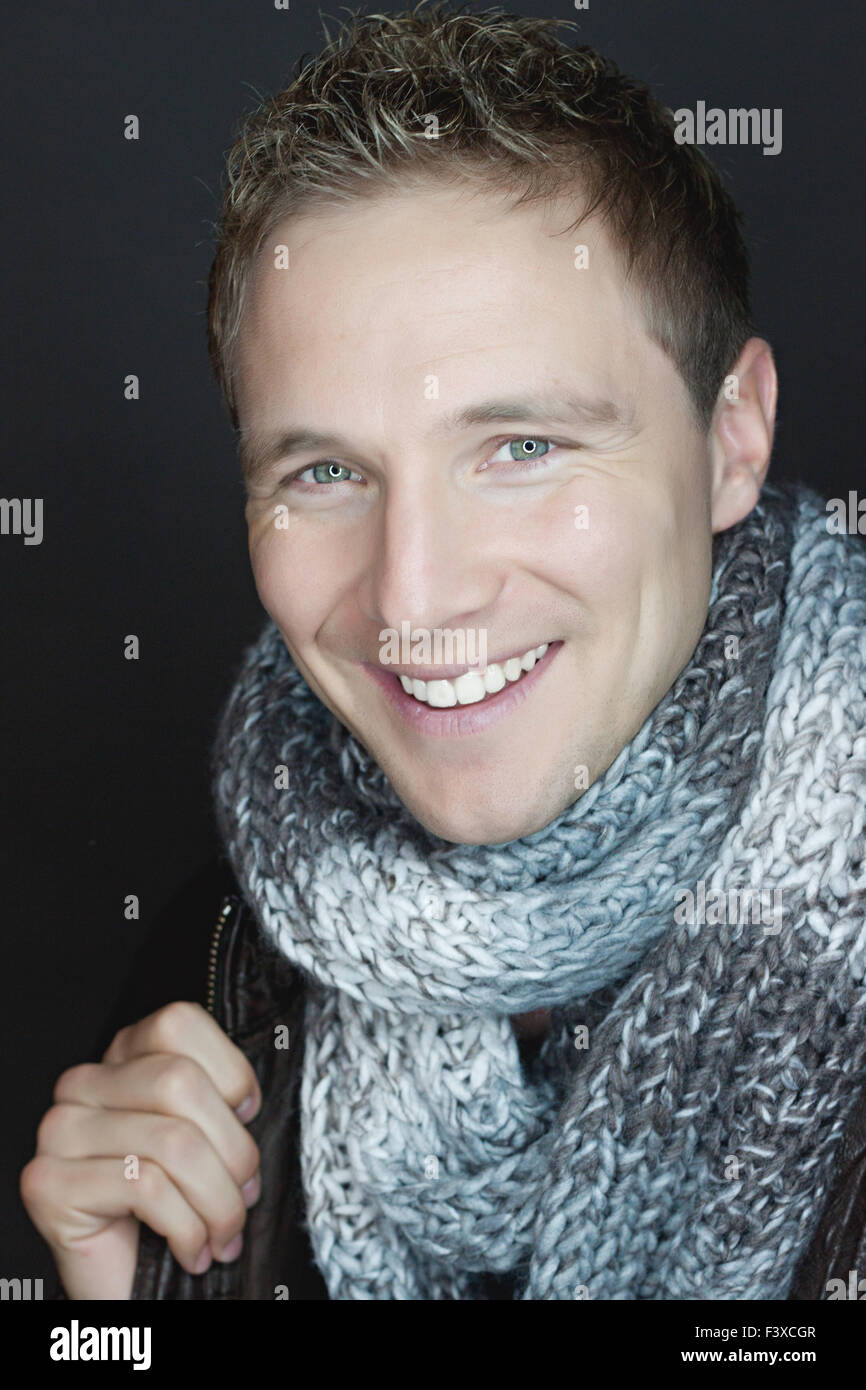 Portrait of a bautiful young man with scarf Stock Photo - Alamy