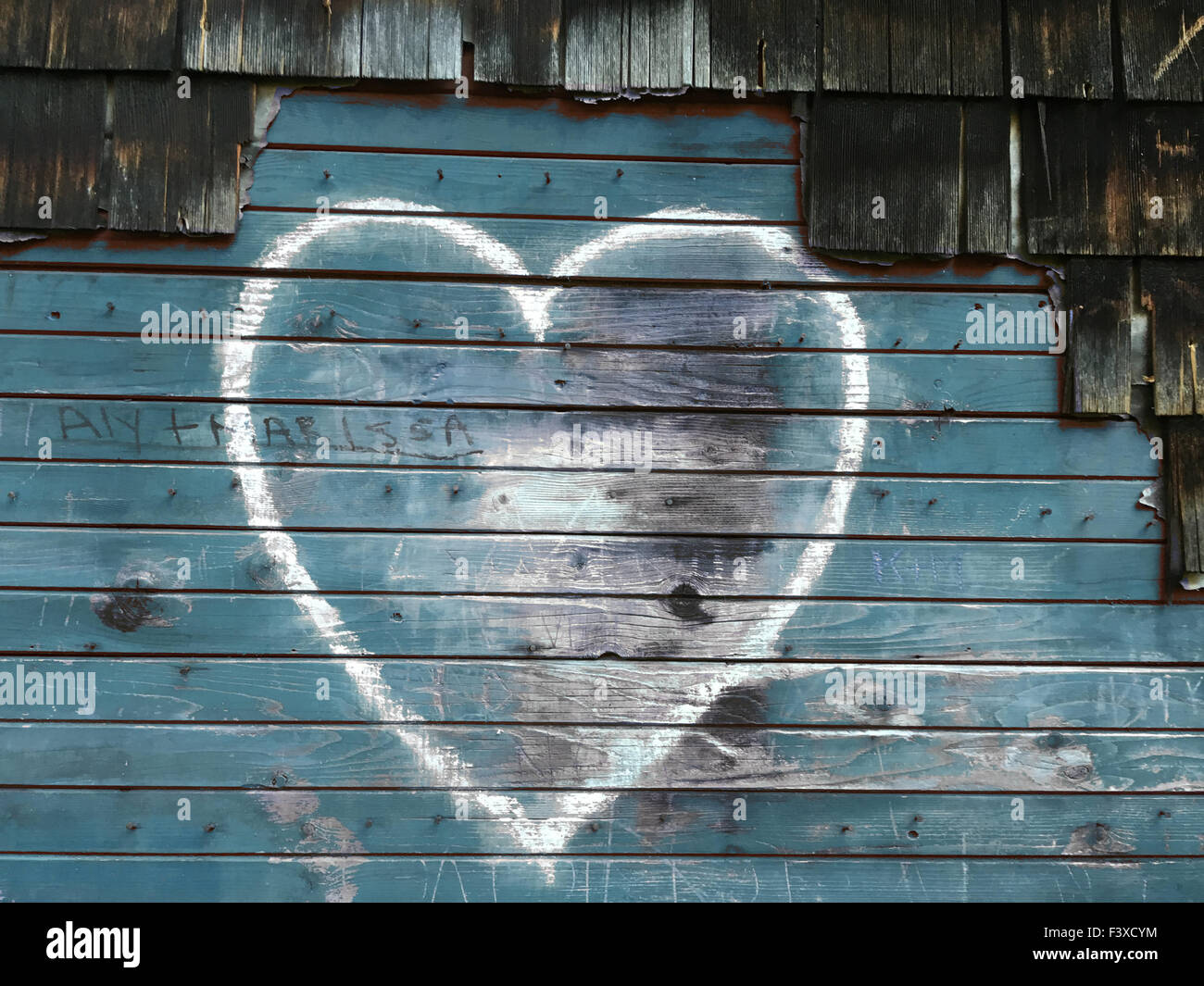Carved heart with a blue textured background Stock Photo - Alamy